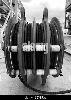 Black rolled cables on white grunge background Stock Photo - Alamy