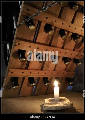 Sparkling wine bottles on a remuage rack Stock Photo - Alamy