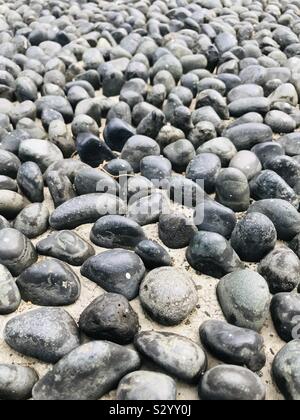 Foot reflexology pebble path Stock Photo - Alamy