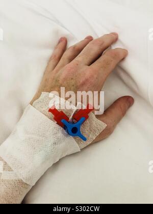Medical intravenous cannula in his hand a sick person Stock Photo - Alamy