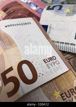 Euro paper notes. European currency on a white background. A purse or ...