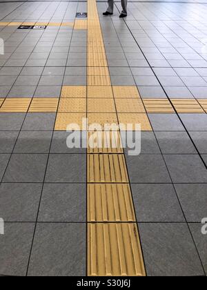 Yellow lines called “Tactile Ground Surface Indicators” (TGSI) or tenji ...