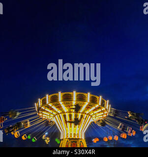 Carousel Merry go round blurr Stock Photo - Alamy