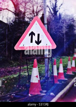Red triangle sign two way traffic Stock Photo - Alamy