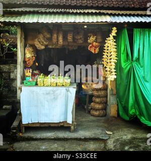 A stall sells items for daily offerings and other festivals in Ubud ...