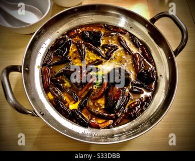 Spicy Chinese style sichuan fish hot pot served with jasmine rice Stock ...