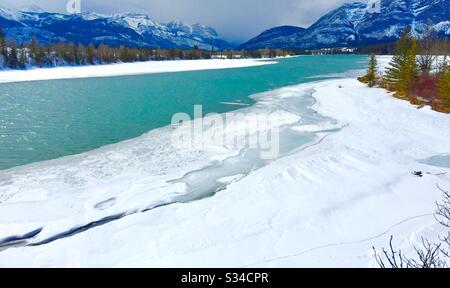 Seebe Dam,Bow River, west of Calgary, Alberta, Canada, yellow booms ...