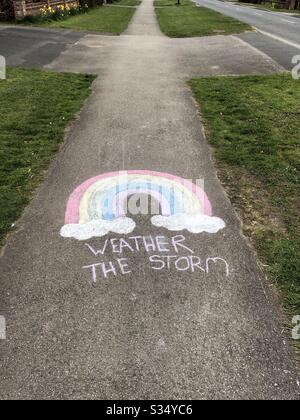 Coronavirus public response rainbow message on pavement sidewalk ...