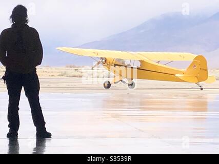 Piper Cub 1934. Pilot and Cub at Bishop Airport, California, USA Stock ...