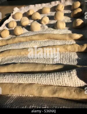 Bread Dough balls and sticks proving Stock Photo - Alamy