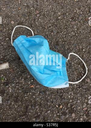 Discarded face mask dropped on the ground during the Covid-19 pandemic ...