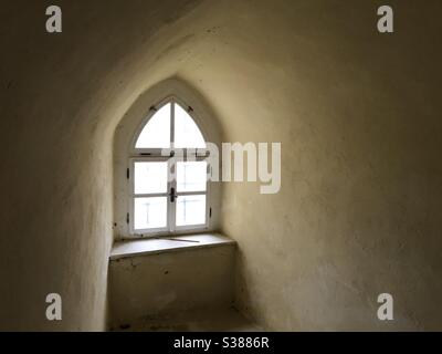 Castle window in a medieval style. Double arched window on a facade of ...