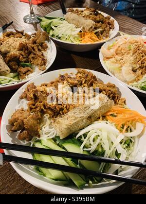 Bun cha is a Vietnamese dish of grilled pork, noodle and herb closeup ...