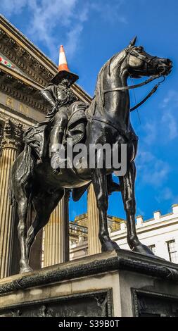 A orange cone on a statue in Boston. Orange traffic cones have been ...