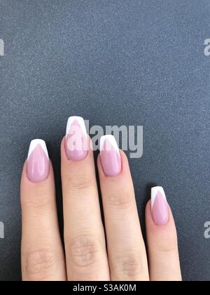French manicure with sharp angled tips Stock Photo - Alamy