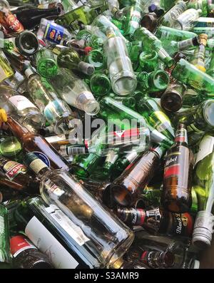 Waste glass and bottles in skip Stock Photo - Alamy