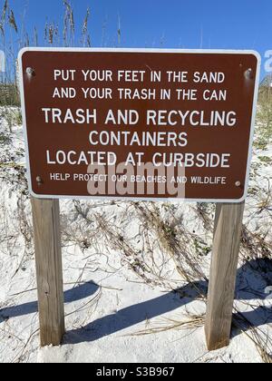 Beach sign with a message to keep the beach clean Stock Photo - Alamy