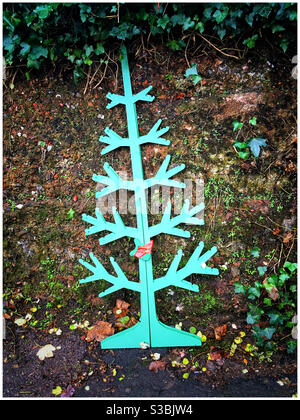 Christmas tree, dumped on the street between 2 parked cars after the ...