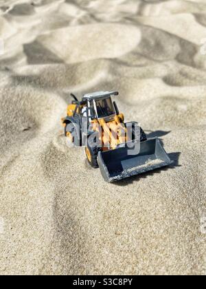 Kids toy sandbox digger excavator Stock Photo - Alamy