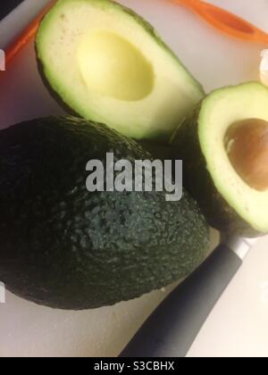 Fresh sliced avocado on cutting board Stock Photo - Alamy