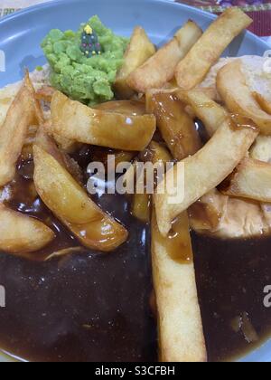 Barm Cake, Chips, Gravy and Mushy Peas and English Food delacy Stock ...
