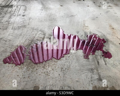 Puddle of engine coolant due to a leak Stock Photo - Alamy