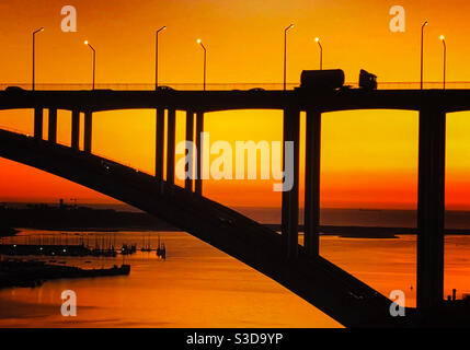 Orange sunset over the bridge silhouette. Ocean hrizon sunny landscape ...