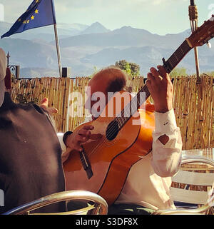 A man plays guitar at a bar in Monterrey, Mexico, Friday, June 12, 2026 ...