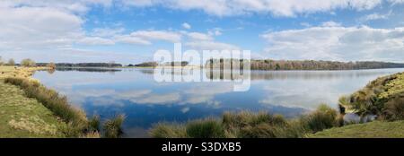 Tatton Mere, Knutsford, Cheshire ... Clouds reflecting on still lake ...