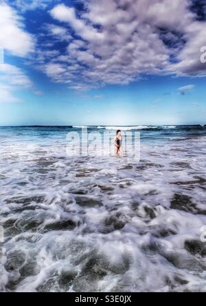 Woman emerging from water Stock Photo - Alamy