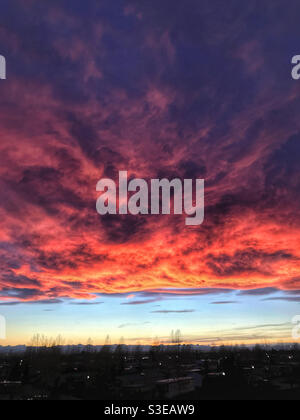 Fiery chinook arch clouds at sunset. Looking towards the Canadian Rocky ...