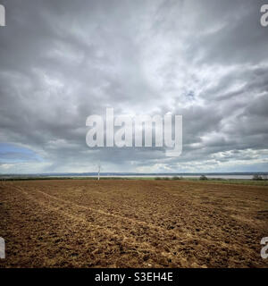 Wind turbine under a dramatic sky Stock Photo - Alamy