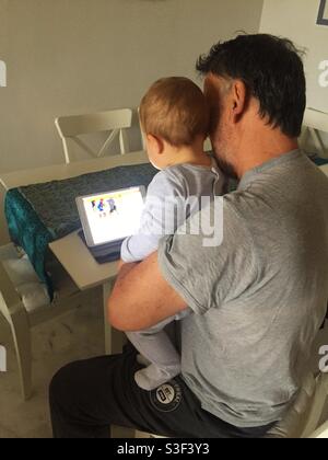 Baby with tablet computer Stock Photo - Alamy