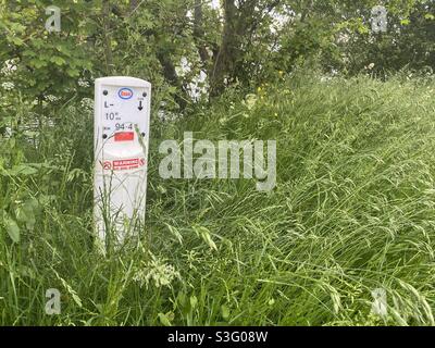 A gas pipeline marker post in the Norfolk countryside at Ringland ...
