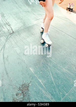 Woman roller-skating on ramp Stock Photo - Alamy