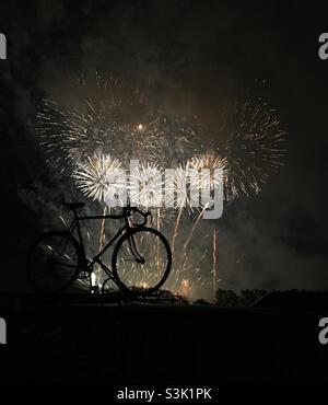 My bicycle silhouetted by fireworks at the Goodwood Members Meeting ...