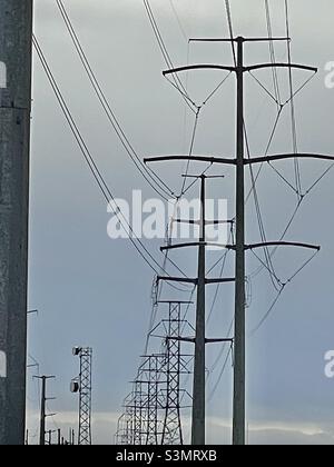 Large electrical distribution power lines and support poles Stock Photo ...