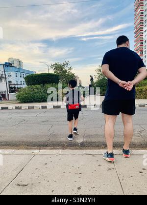 Father and son crossing street Stock Photo - Alamy