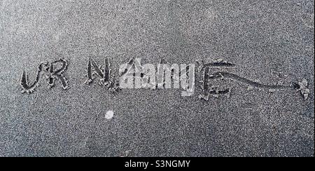 wish you were here written in the sand on a beach Stock Photo - Alamy