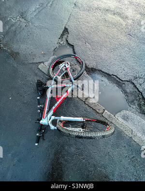 Mountain bike on tarmac next to puddle Stock Photo - Alamy