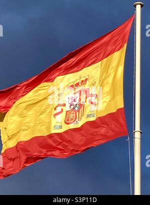 Flying Flag of Spain in Madrid center Stock Photo - Alamy