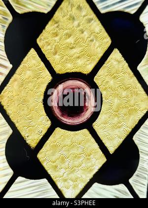 The diamond shaped pattern of a stained glass window UK Stock Photo - Alamy