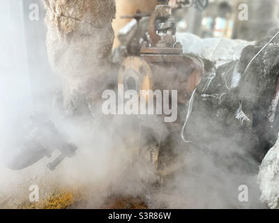 Close up of the outlet valve on an industrial IBC container used for ...