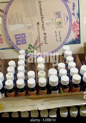 Bottles of essential oils and text NATURAL COSMETICS on light ...