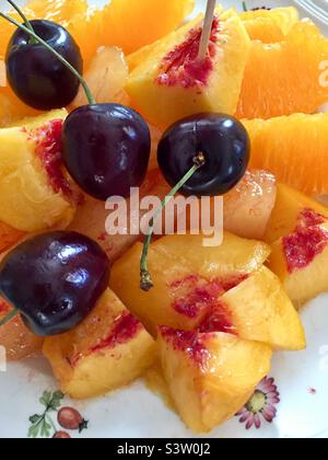Cherries and oranges Stock Photo - Alamy