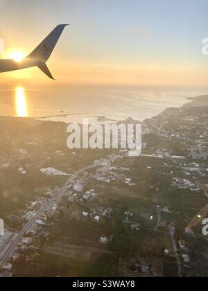 View from the plane at sunset Stock Photo - Alamy