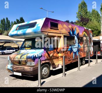 Large RV decorated with colourful murals Stock Photo - Alamy