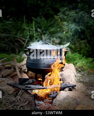 Cast iron cauldron over an open turf fire in a traditional Irish ...
