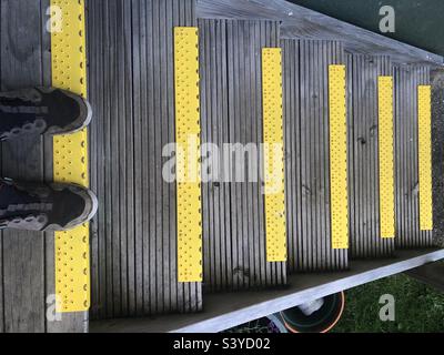 Outdoor steps with yellow visibility strips Stock Photo - Alamy