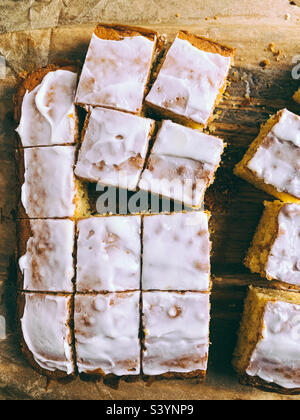 Homemade sponge tray bake with icing topping Stock Photo - Alamy